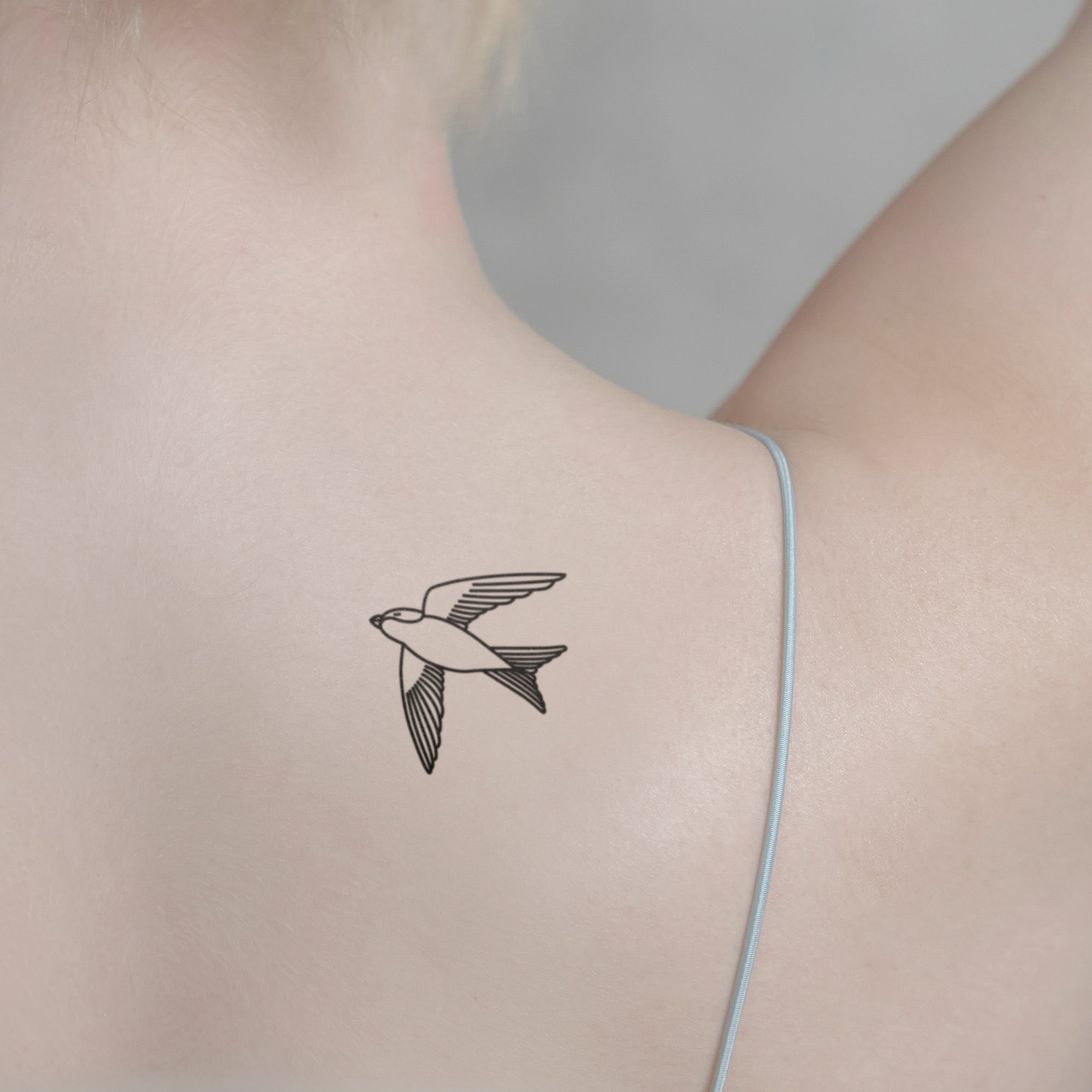 Bedeutung Des Vogeltattoos Hinter Dem Ohr